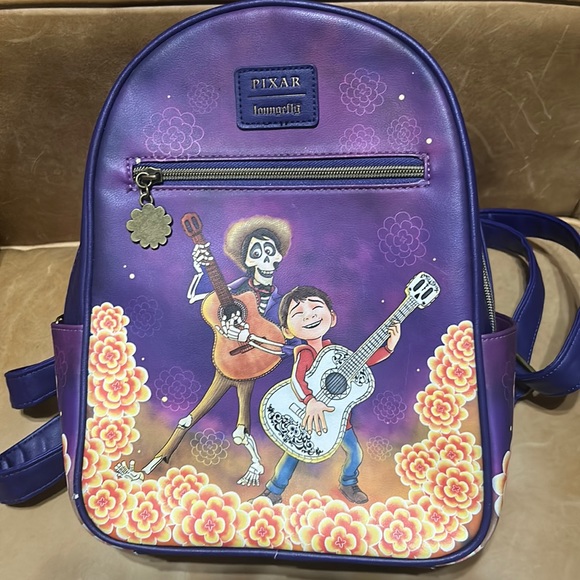 Loungefly | Bags | Loungefly Coco Pixar Disney Marigold Mini Backpack ...